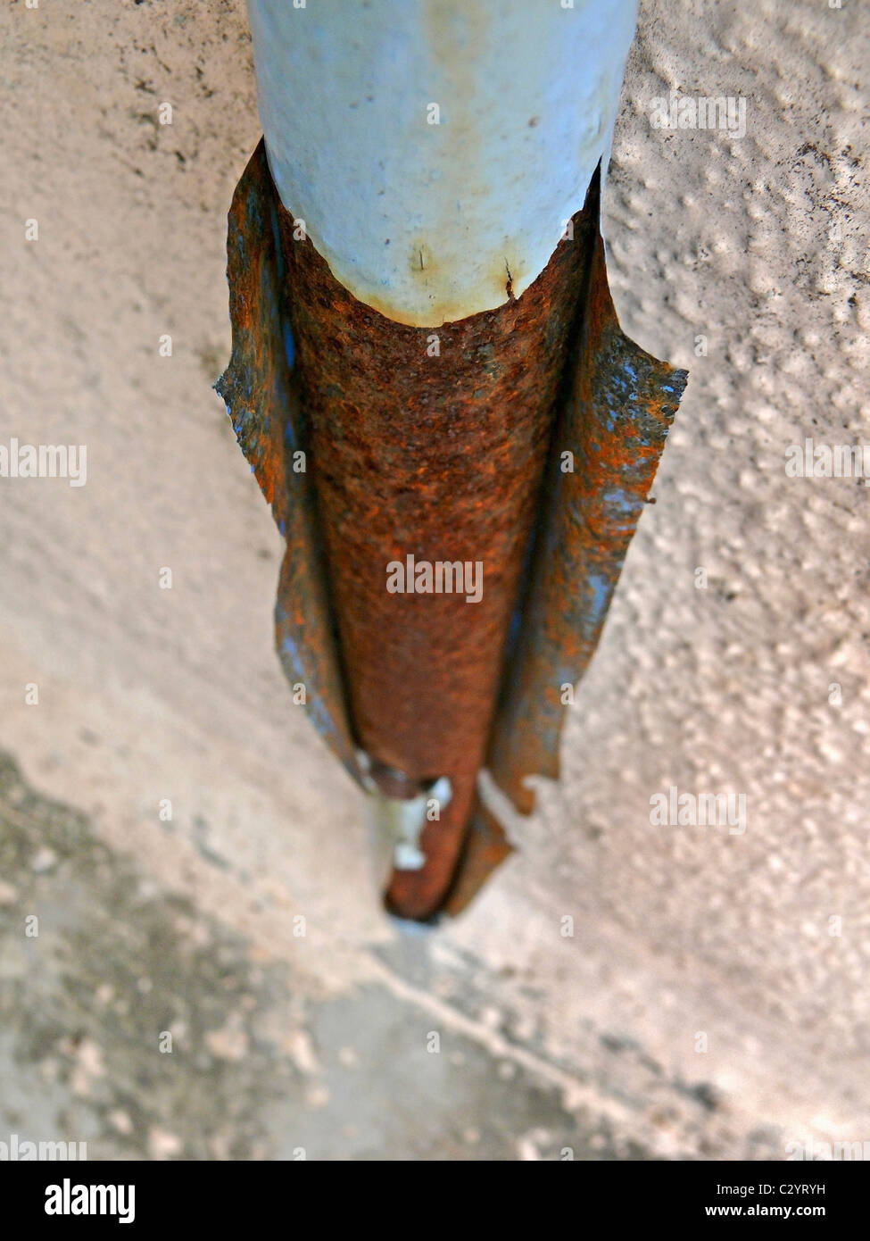 Damaged, Rusted Rain water waste away on parapet wall Stock Photo - Alamy