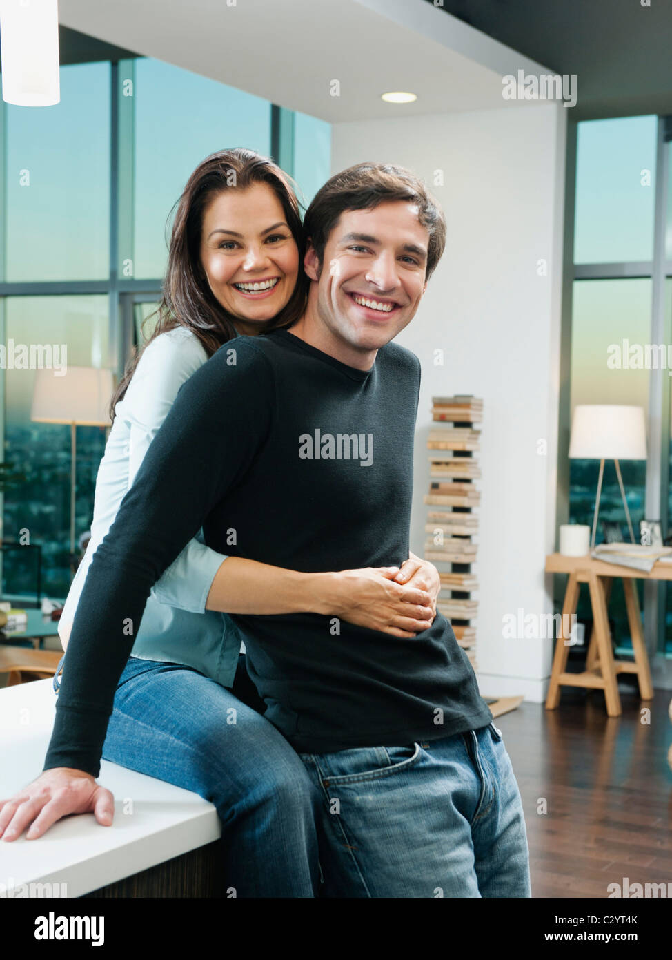 Smiling couple hugging Stock Photo - Alamy
