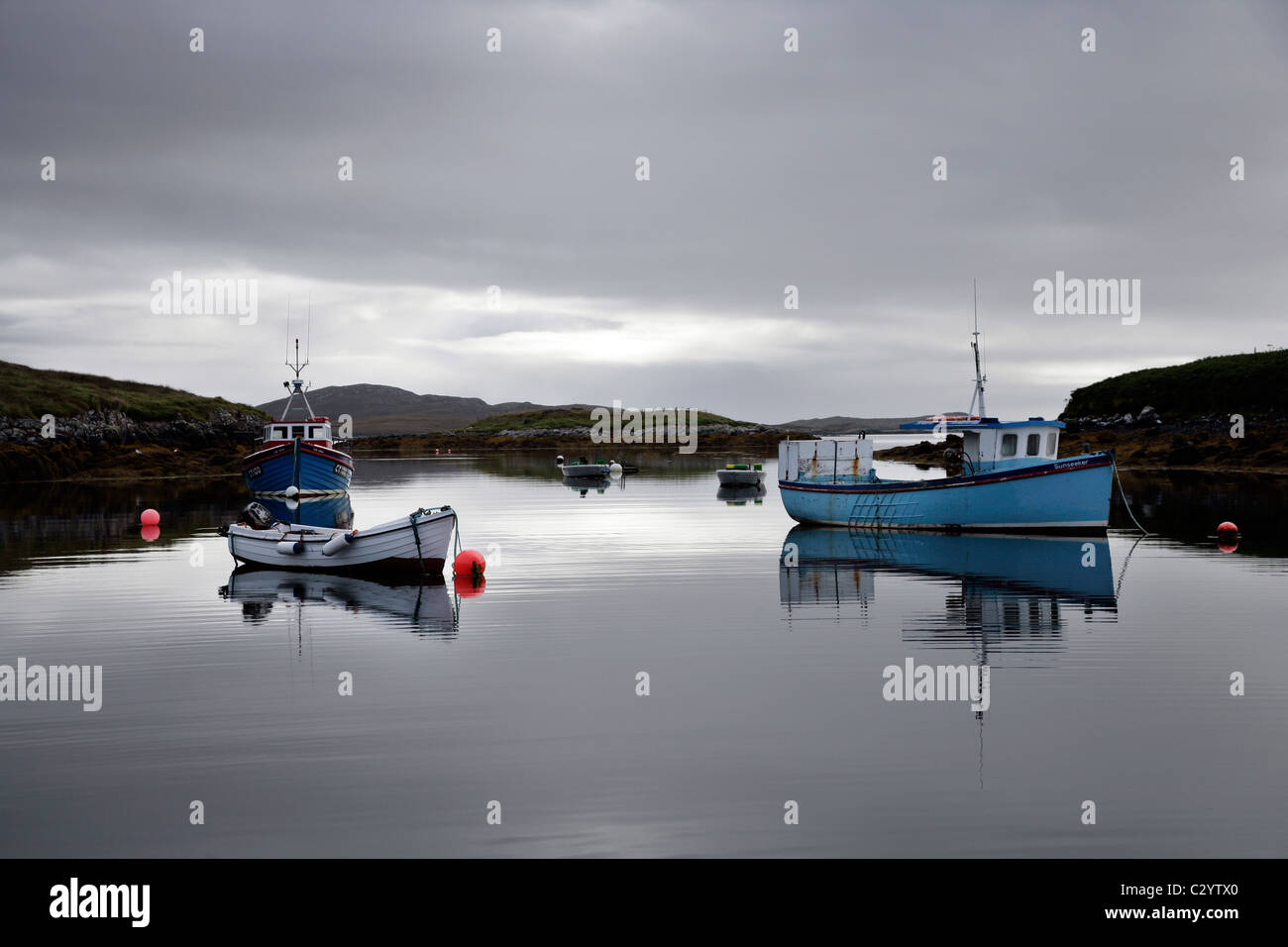 View of Lochmaddy harbour from a boat heading out to sea. Lochmaddy ...