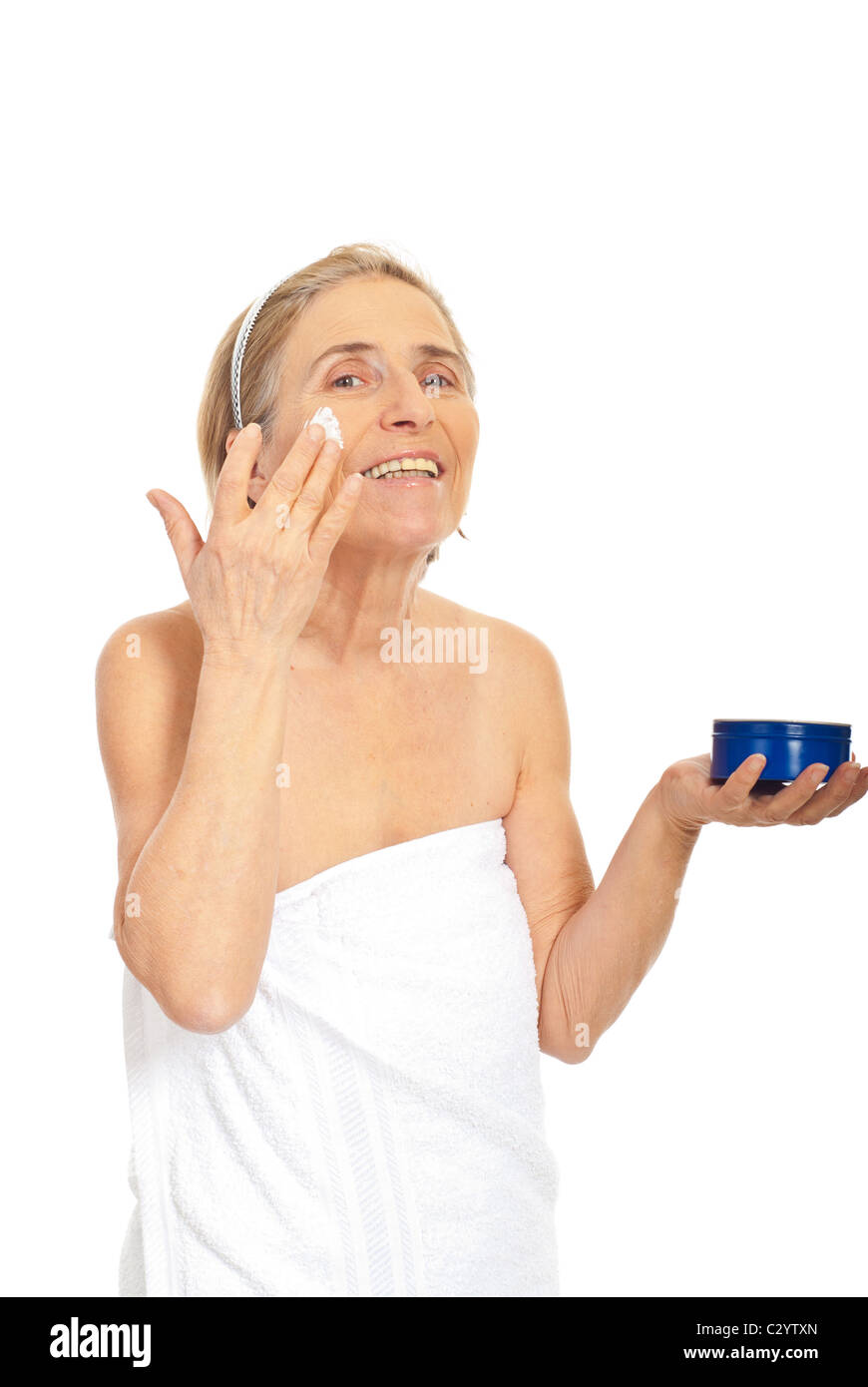 Female applying moisturizing face Cut Out Stock Images & Pictures - Alamy