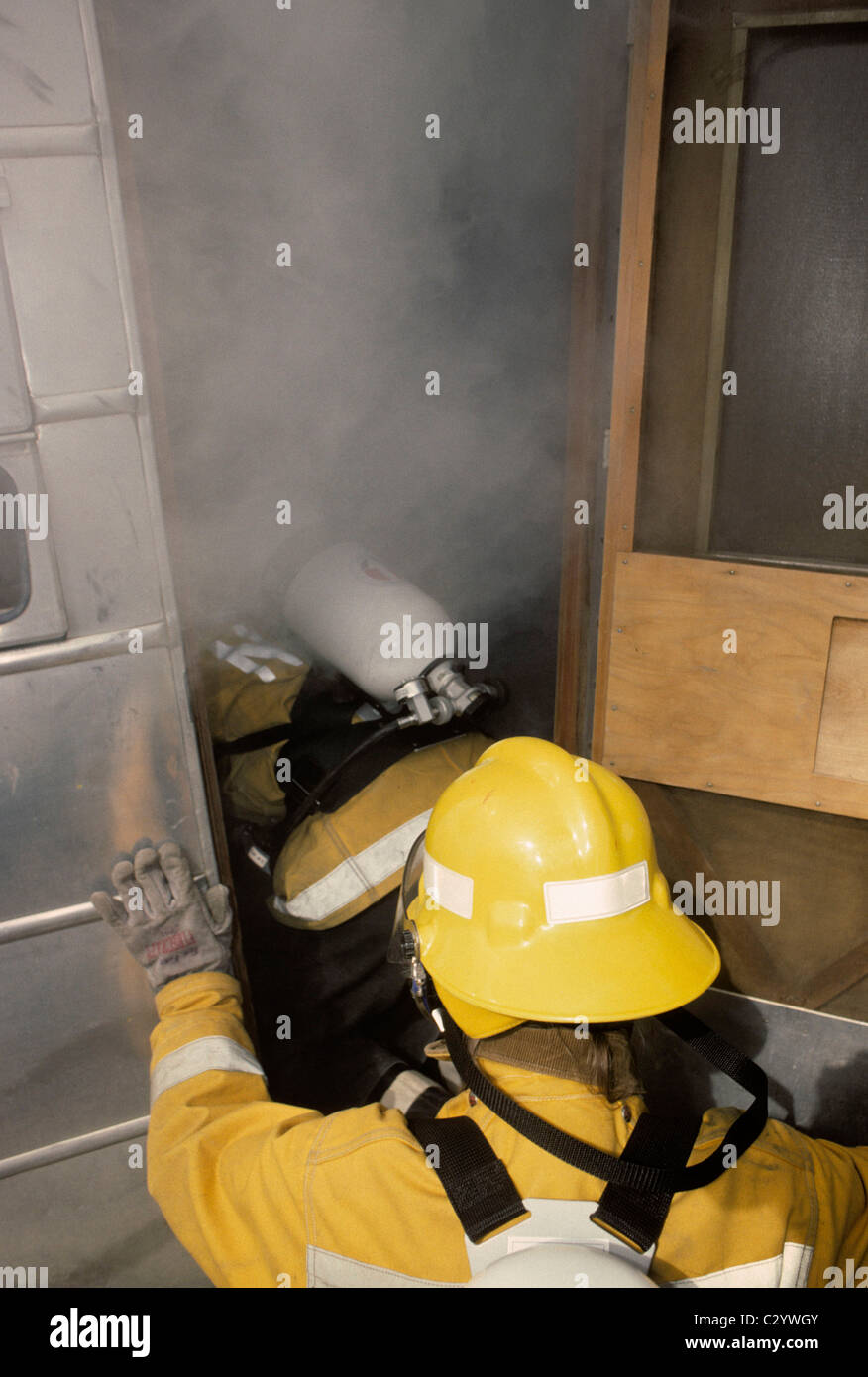 Smoke, flames, firefighters with air packs, Structural Firefighter ...