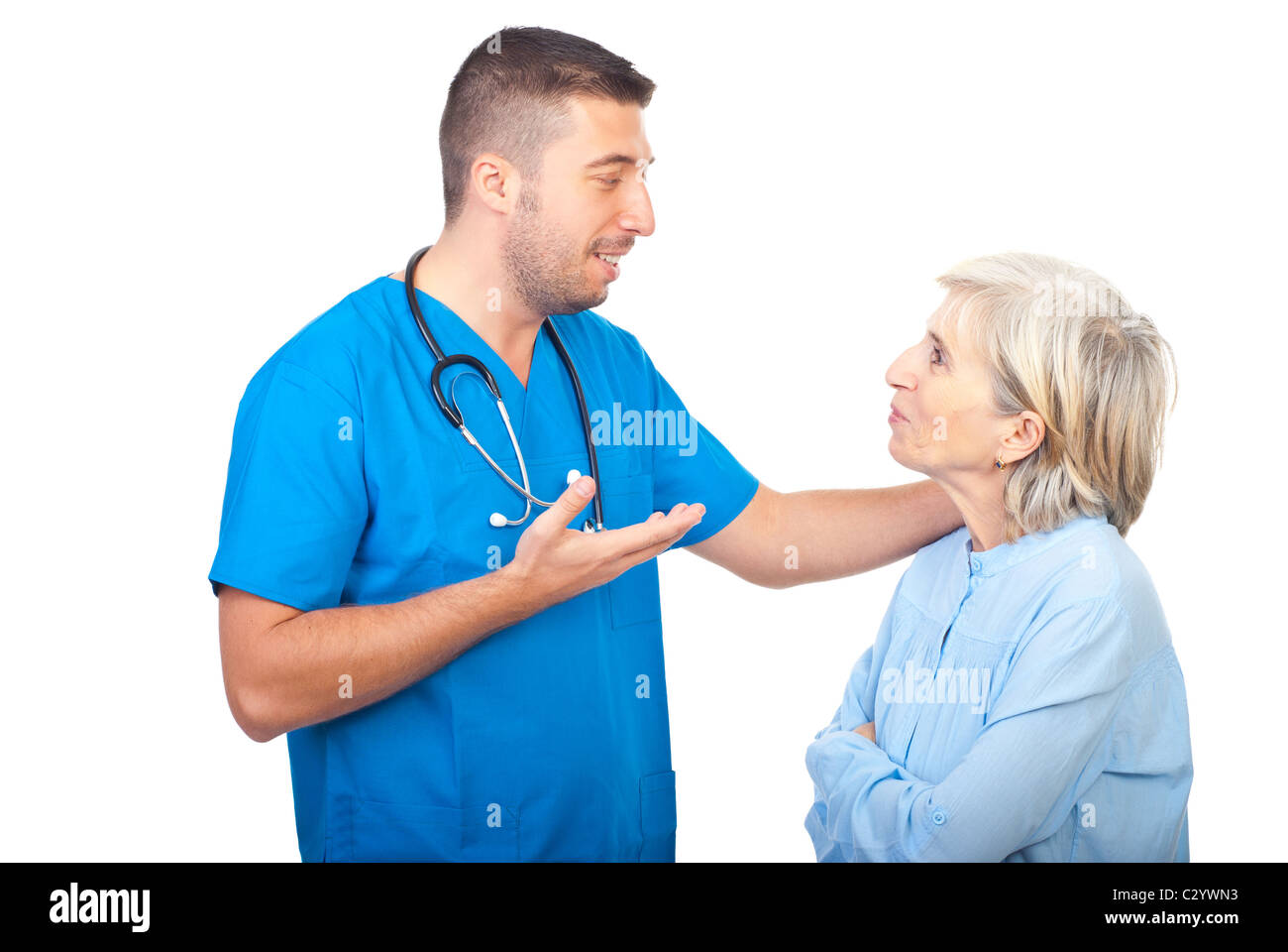 Caring doctor giving explanation to a senior woman patient isolated on ...
