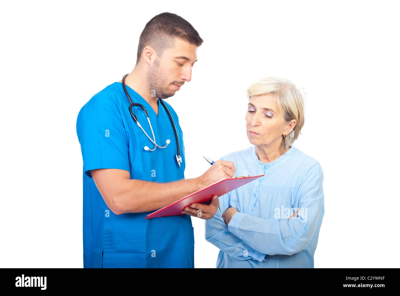 Doctor writing prescription for senior patient woman and giving ...