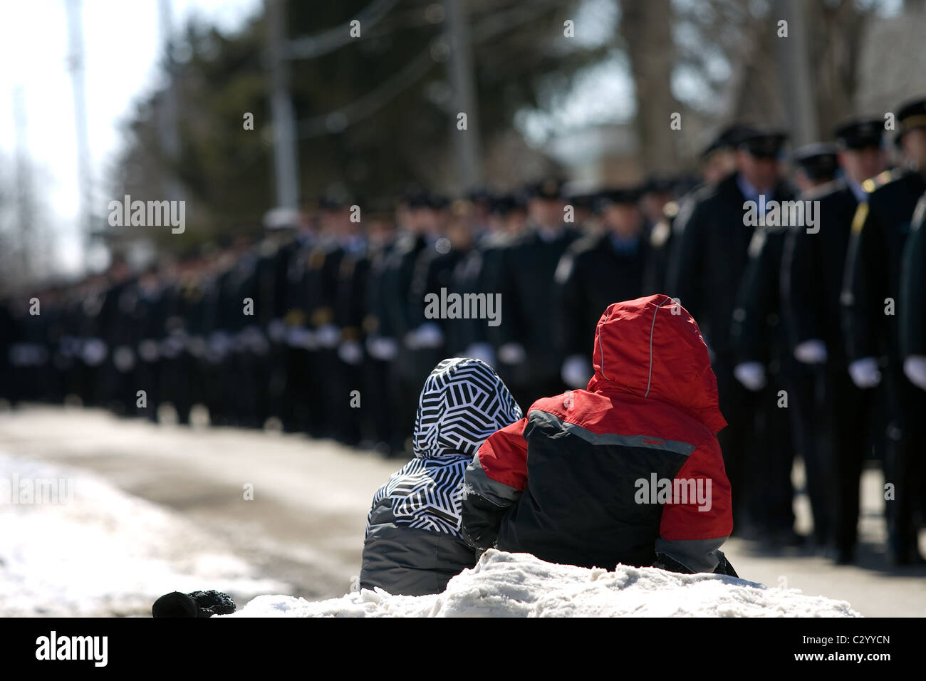 Two young boys watch 1000s of firefighters march in the funeral ...