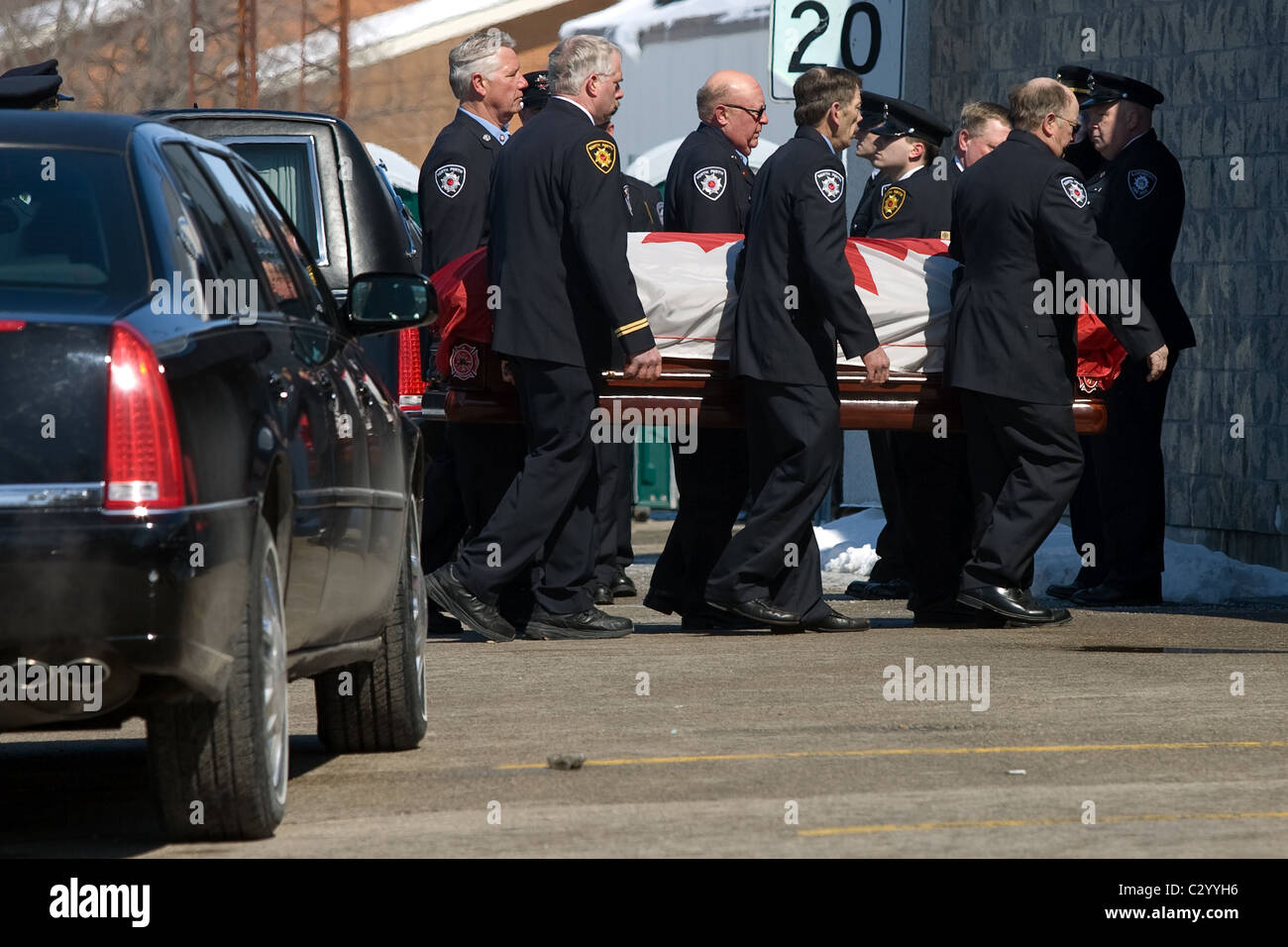 The casket carrying the remains of volunteer firefighter Ray Walter is ...