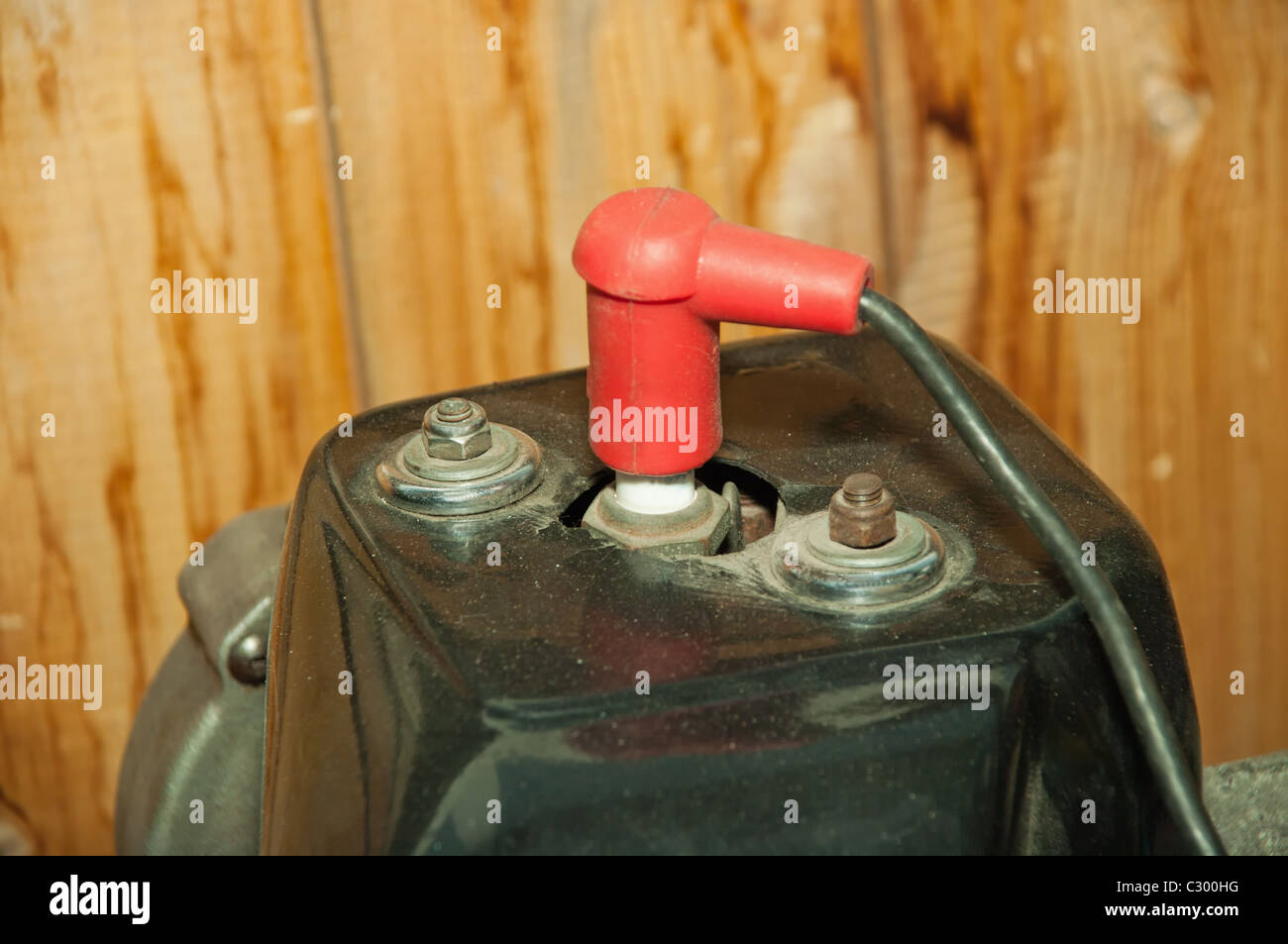 Motor spark plug with red cable old Stock Photo - Alamy