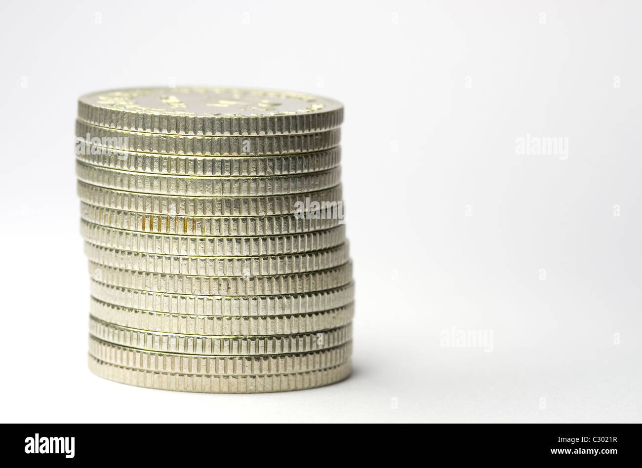 Stack of coins on white background Stock Photo - Alamy