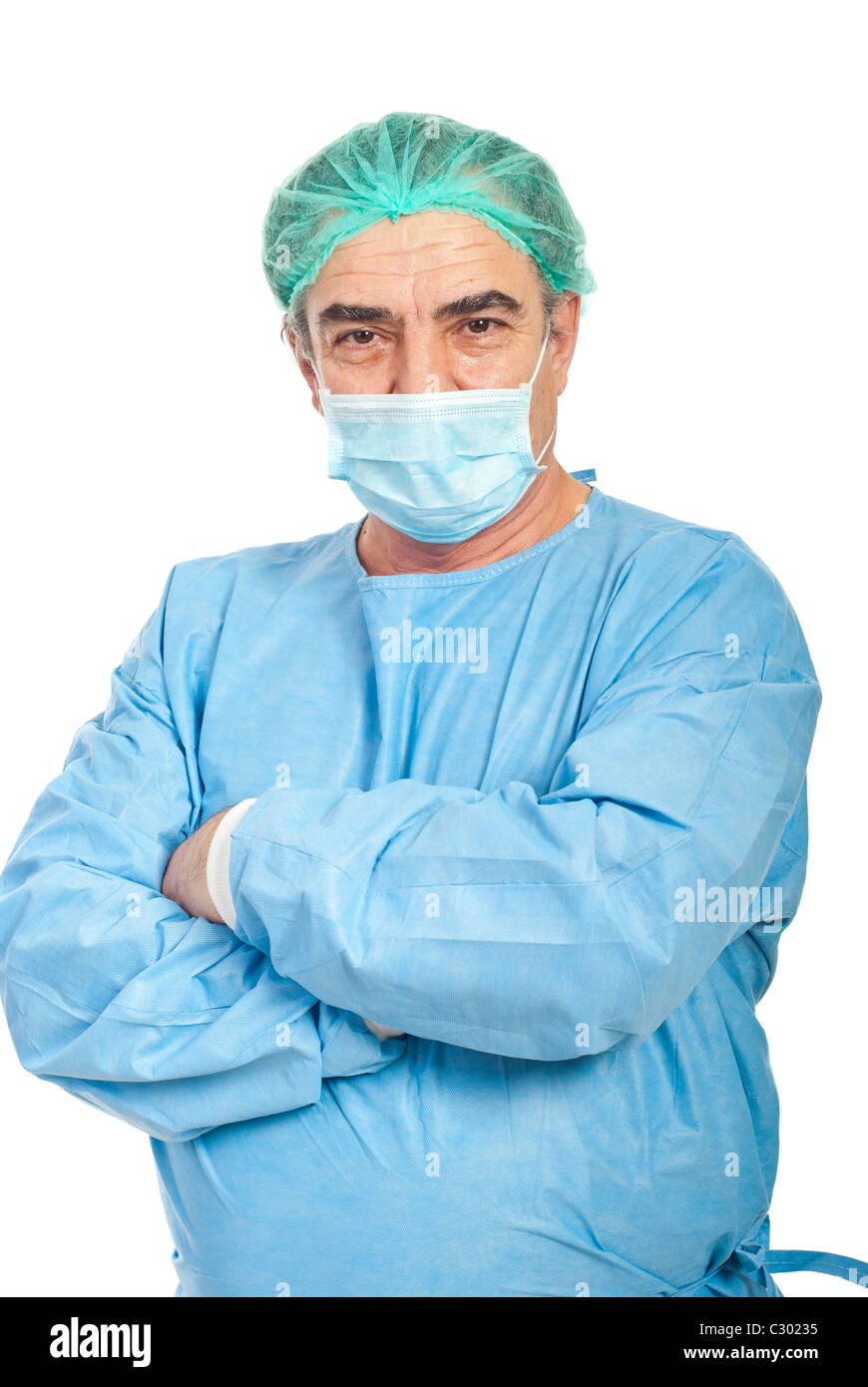 Close up of mature surgeon man standing with arms folded and wearing ...