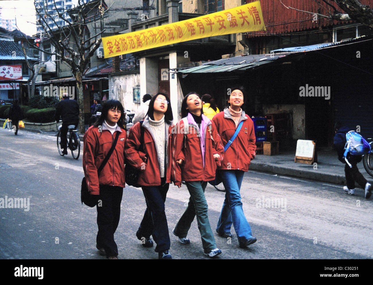 Shanghai, China. four Chinese teenagers schoolgirls in school uniform ...