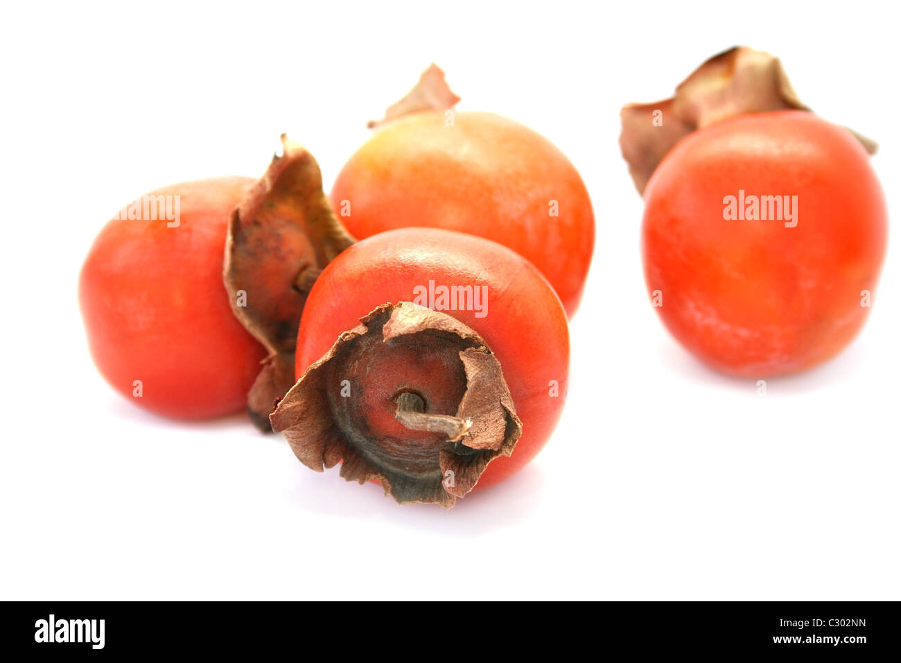 Ripe persimmons isolated on white background Stock Photo - Alamy