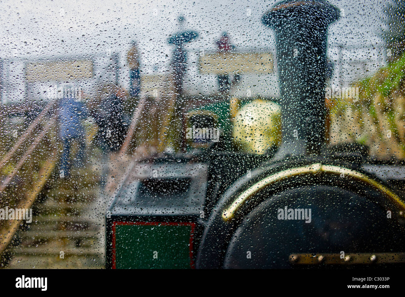 a steam engine seen through a rain covered window Stock Photo - Alamy