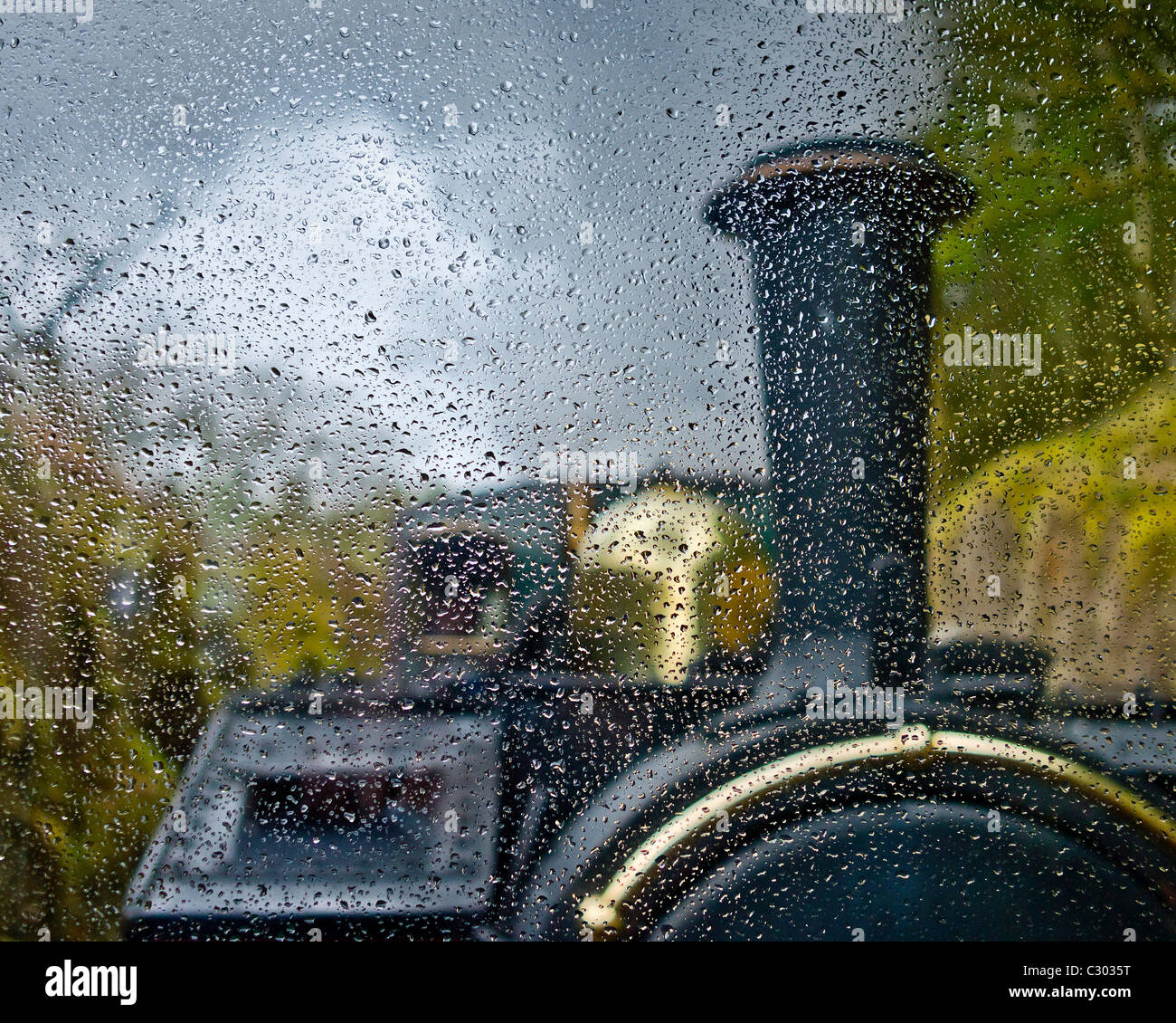 Rain on the Ffestiniog; a steam engine seen through a rain covered ...