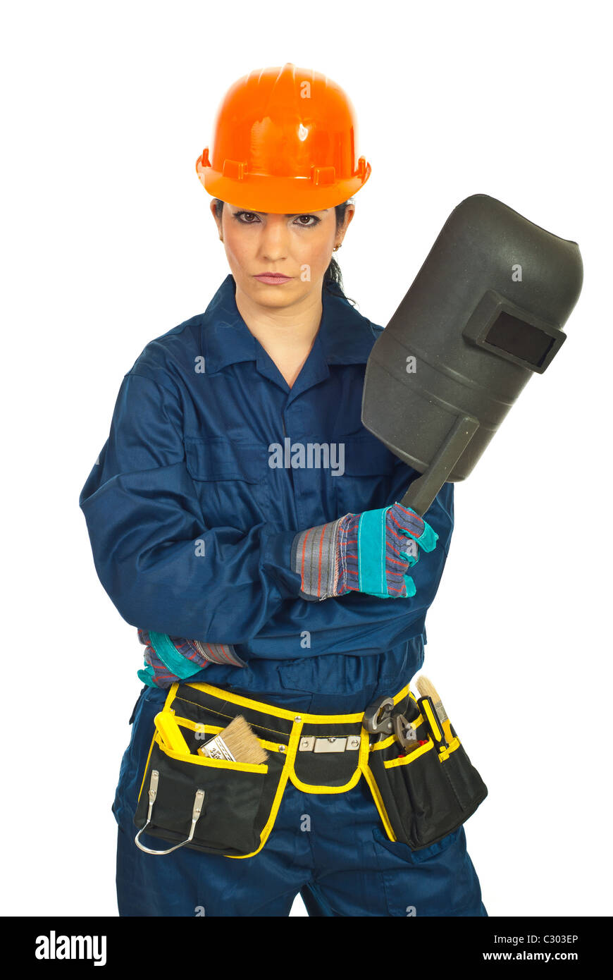 Serious welder worker woman holding welding mask against white ...