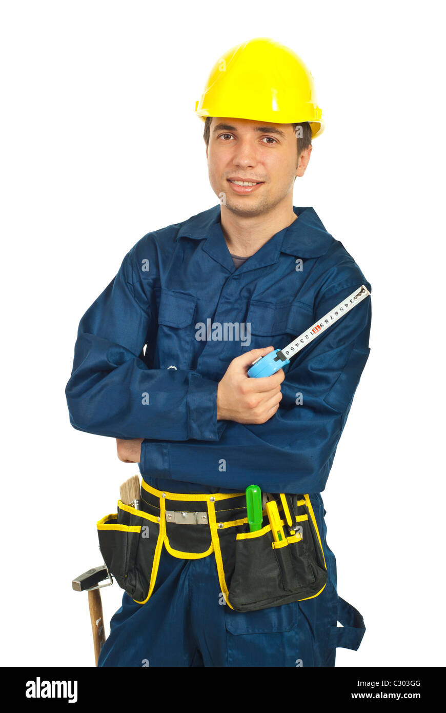 Smiling young workman holding ruler isolated on white background Stock ...