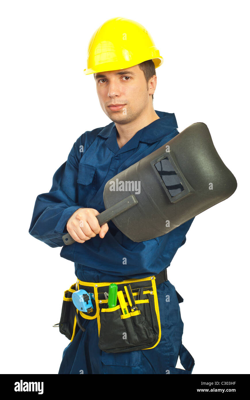 Young welder man holding welding mask isolated on white background ...