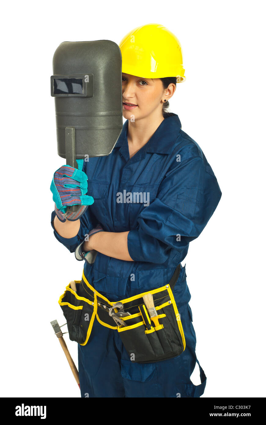 Young welder woman holding welding mask isolated on white background ...