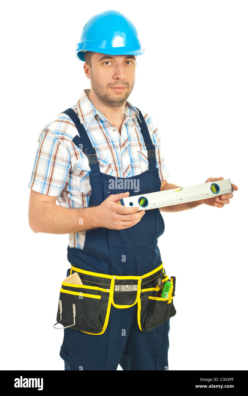 Mid adult worker man holding bubble level isolated on white background ...