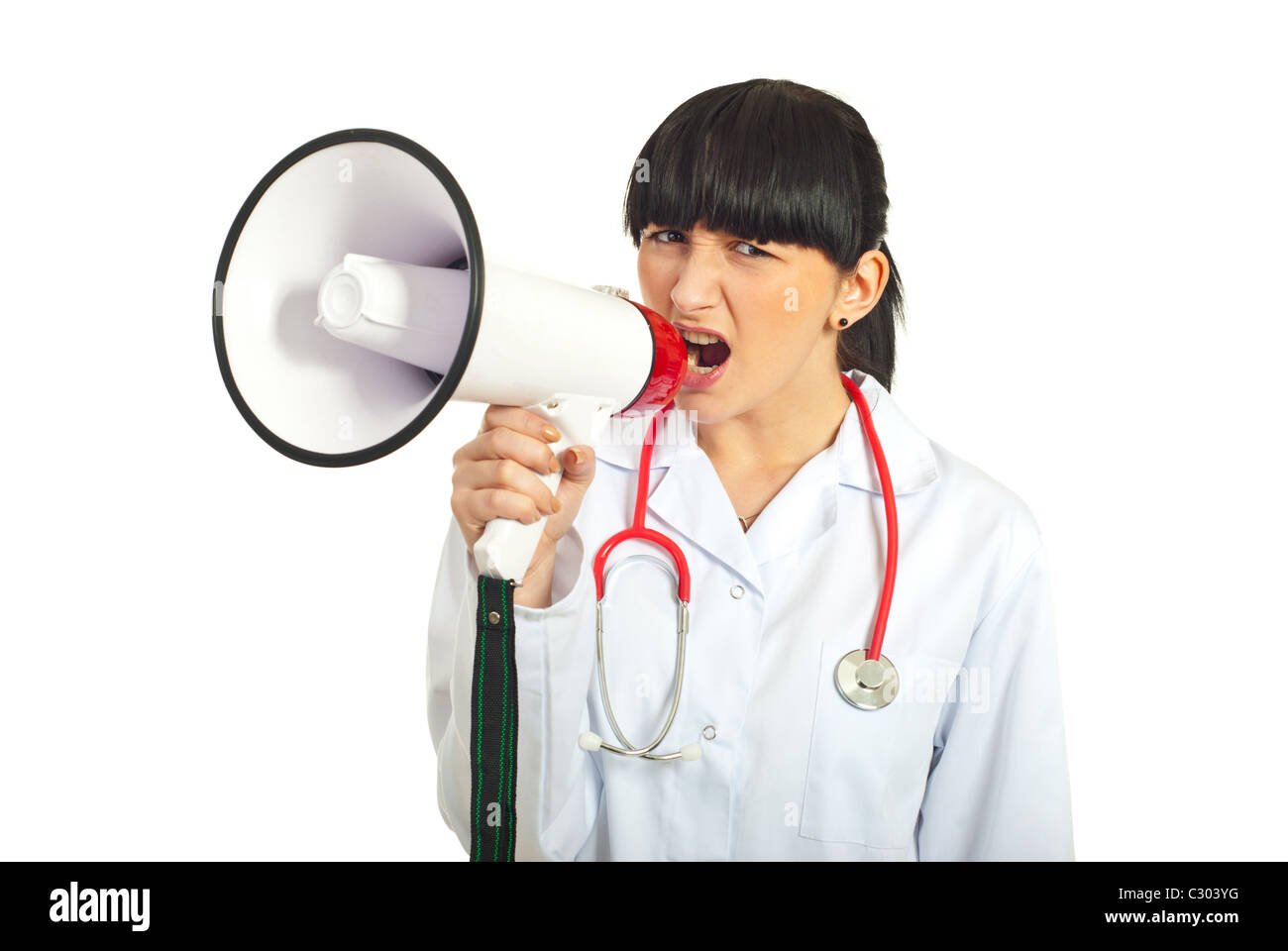 Unhappy doctor woman shouting in megaphone isolated on white background ...