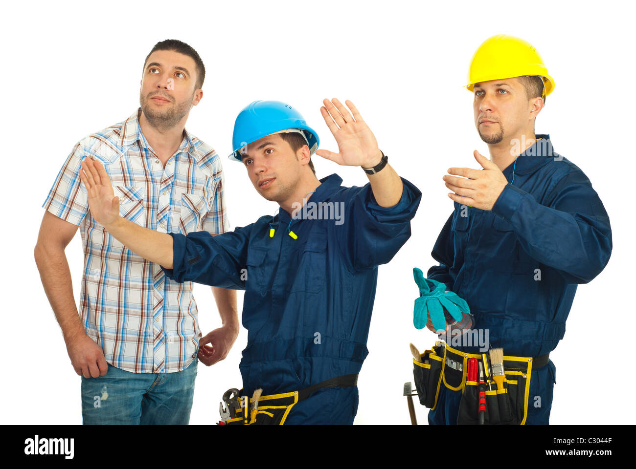 Repairman team explaining and showing something to a client man ...