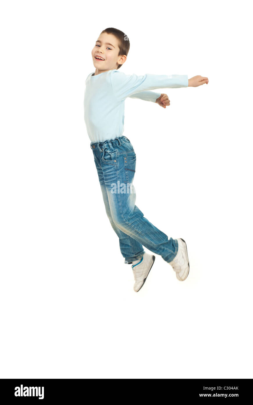 Happy boy kid jumping isolated on white background Stock Photo - Alamy