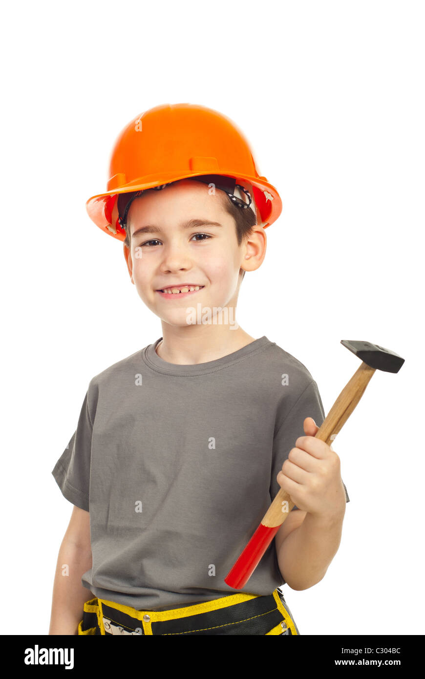 Kid boy with orange helmet holding hammer and smiling against white ...