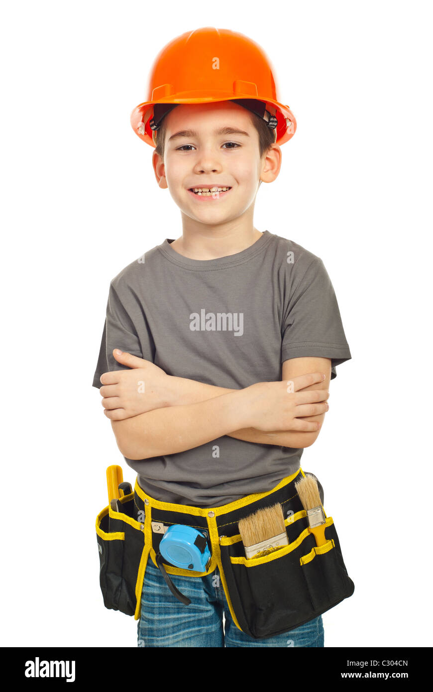 Happy worker boy with helmet and tools standing with arms folded ...