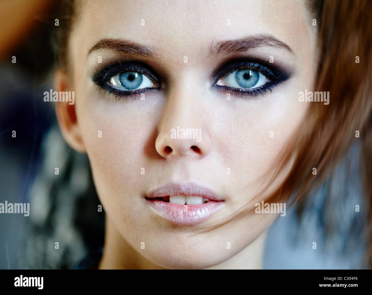 Face of gorgeous woman looking at camera Stock Photo - Alamy