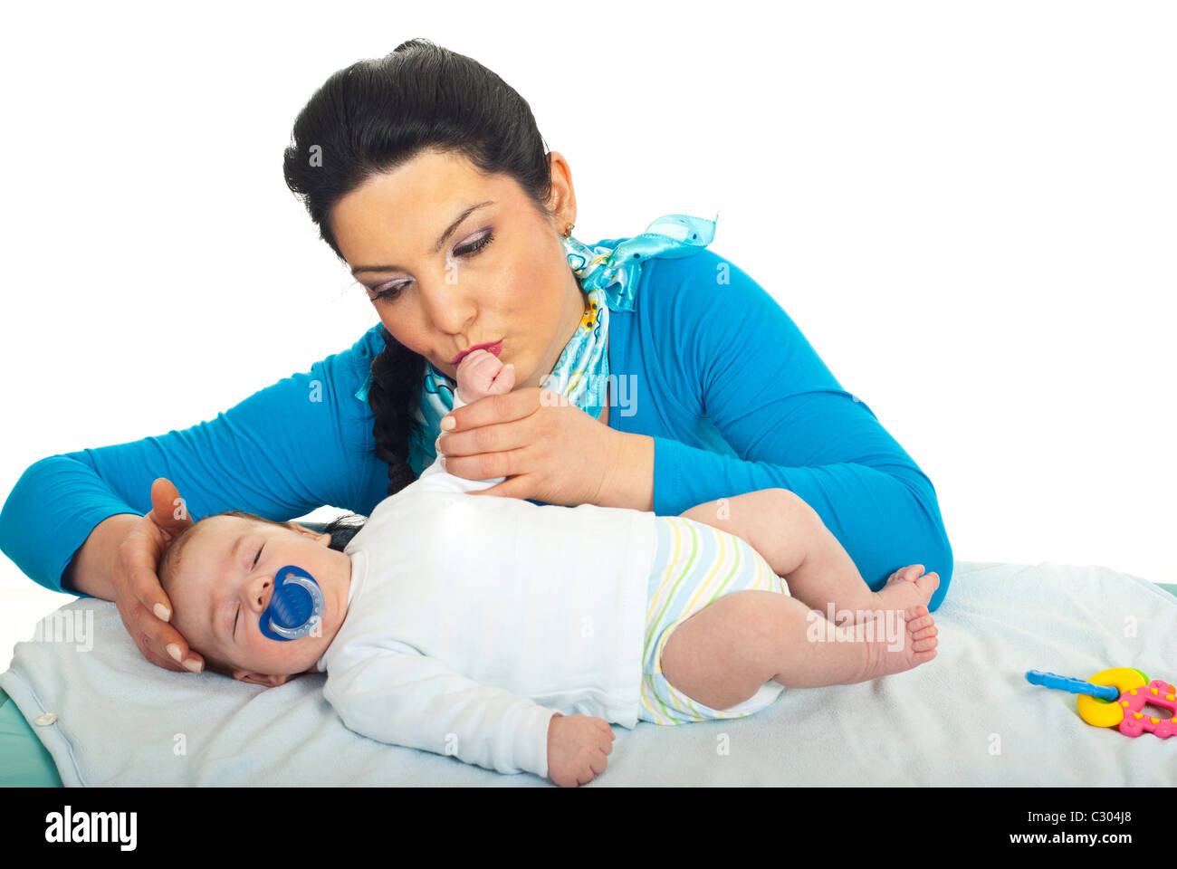 Mother caress her newborn baby,kissing his hand and touching head Stock ...