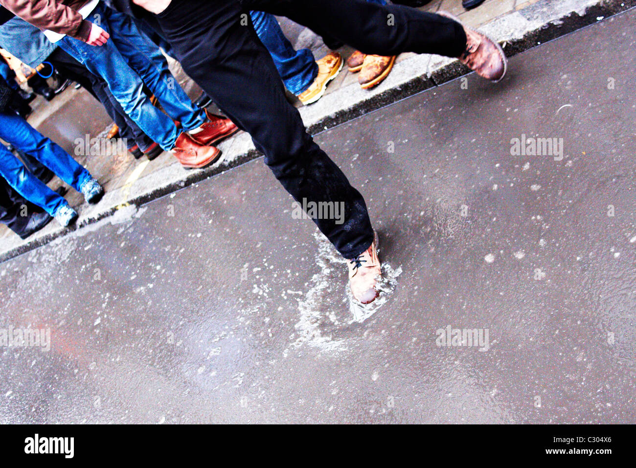Puddle splash soaked hi-res stock photography and images - Alamy