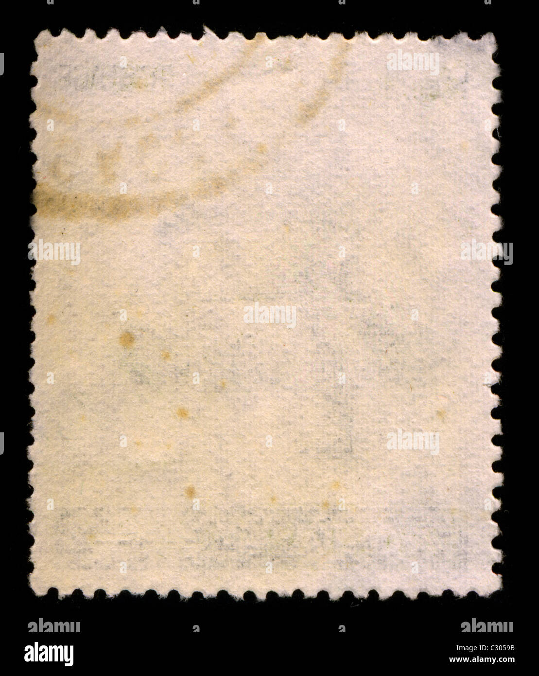 The reverse side of a postage stamp Stock Photo - Alamy