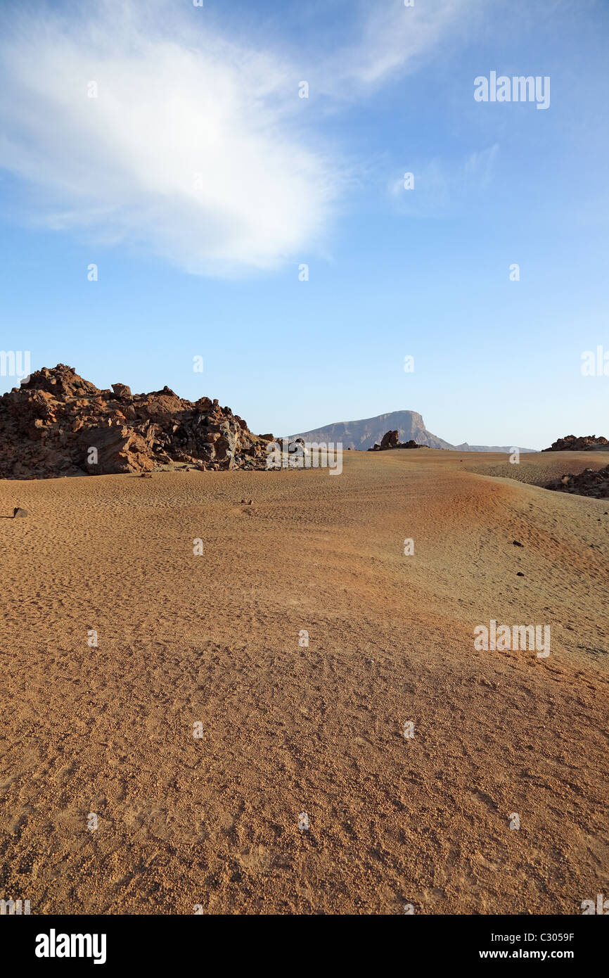 Volcanic desert at Tenerife Canary island. Blue sky, arid dry sand heat ...