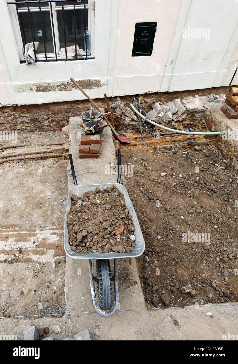 Wheelbarrow on a road construction site Stock Photo - Alamy