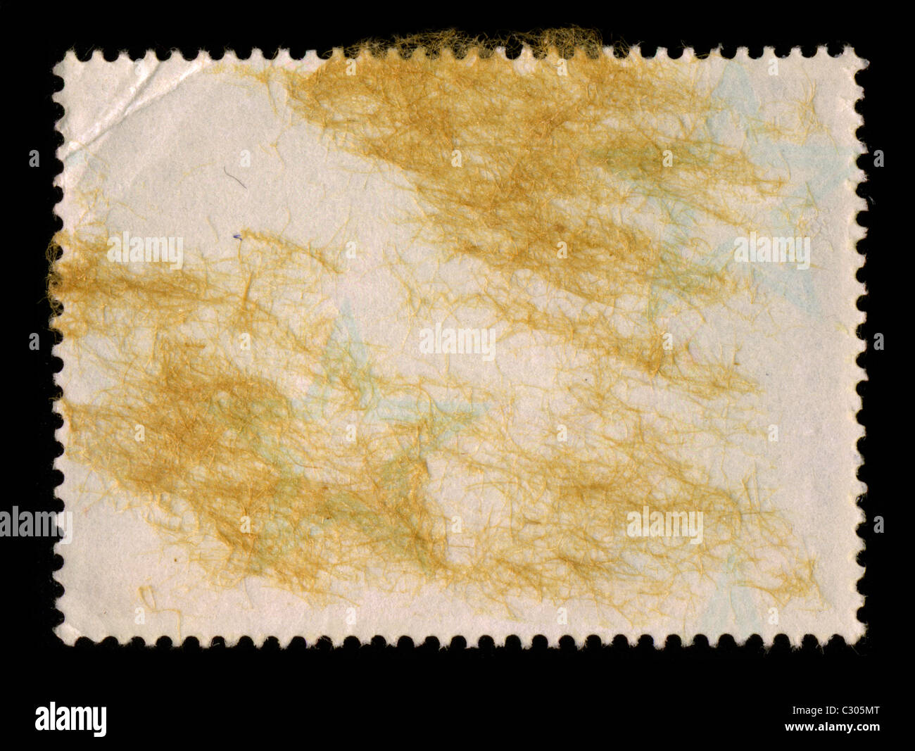 The reverse side of a postage stamp Stock Photo - Alamy