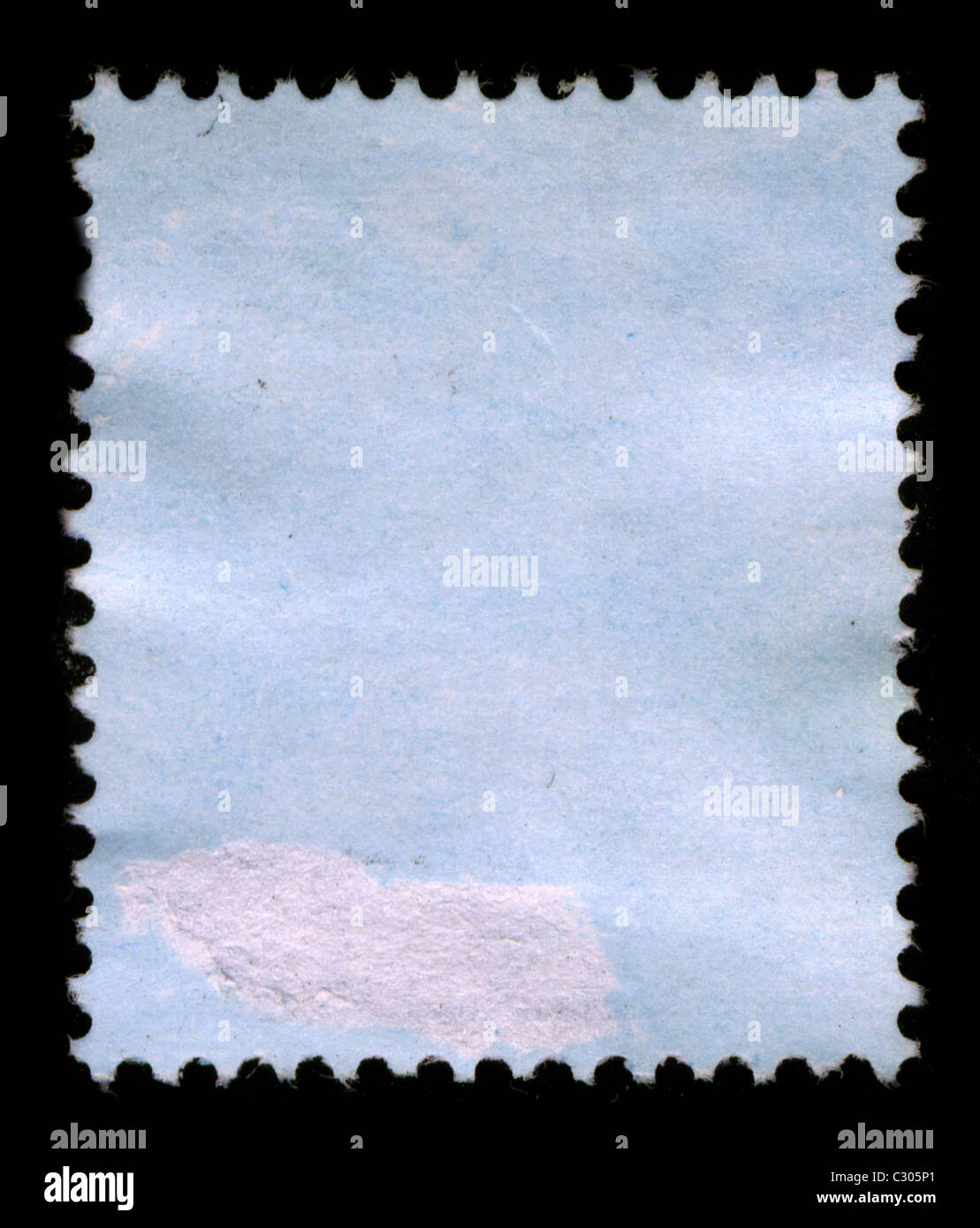 The reverse side of a postage stamp Stock Photo - Alamy