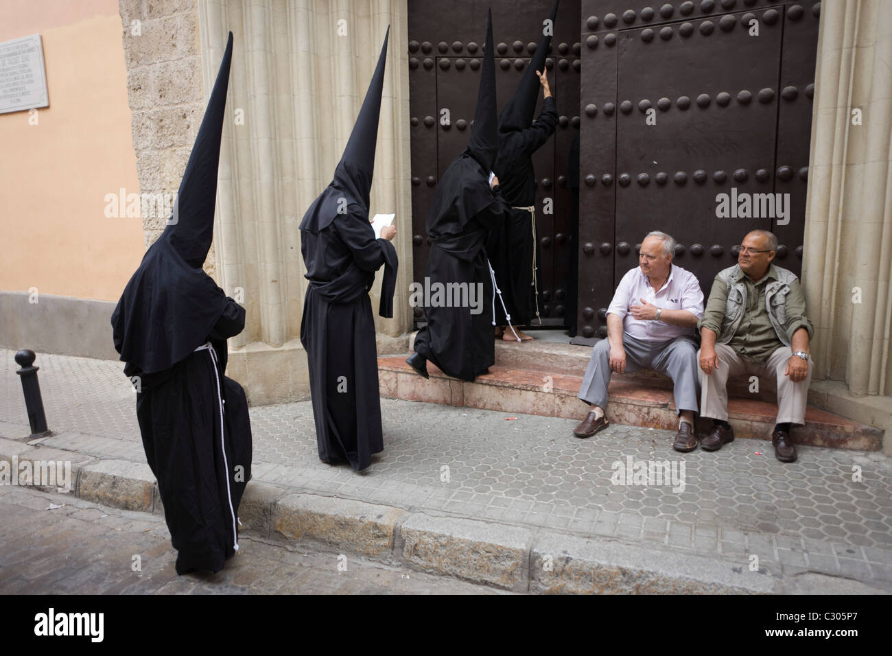 Hooded penitents (Nazarenos) during Seville's annual Easter Holy Week ...