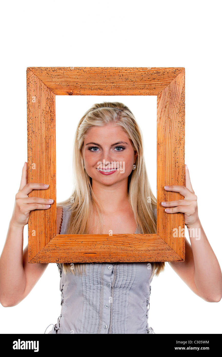 Woman looking through a picture frame Stock Photo - Alamy