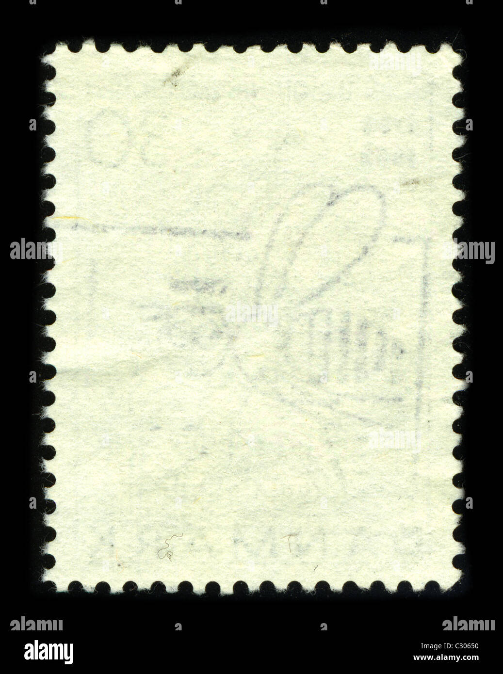 The reverse side of a postage stamp Stock Photo - Alamy