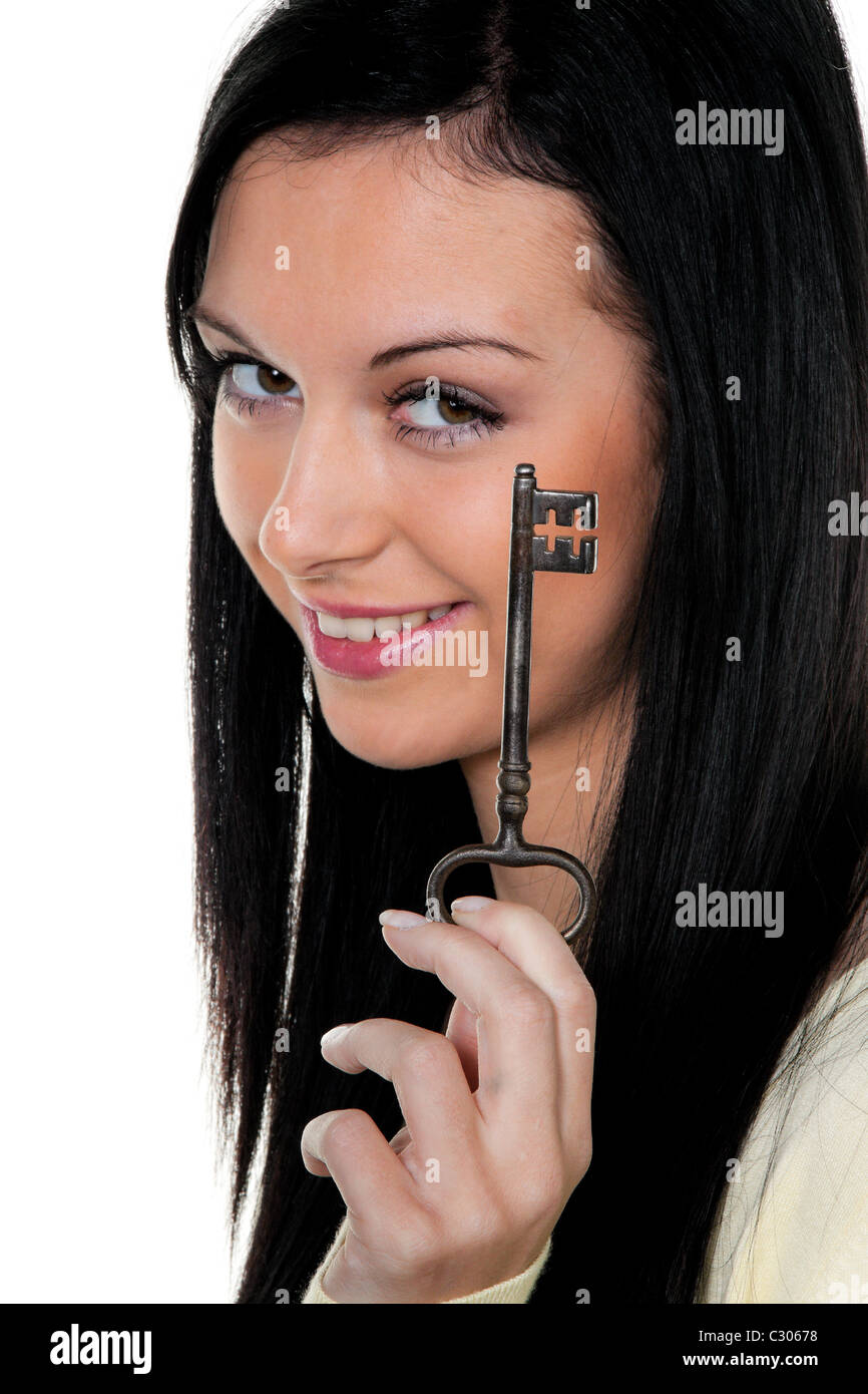 Woman with house key Stock Photo - Alamy