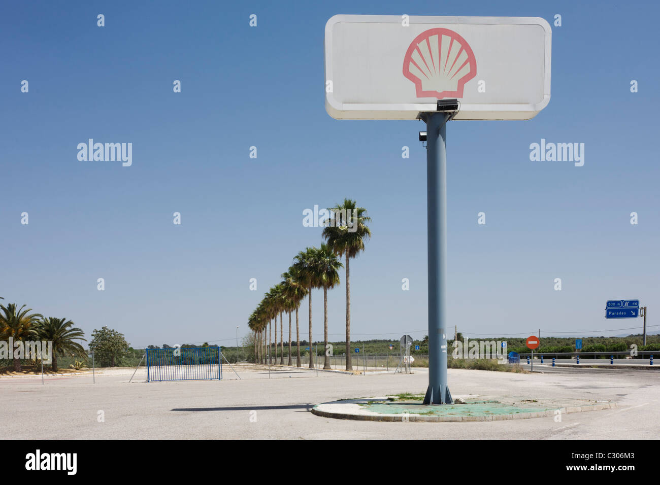 A tall Shell sign seems to echo the palm tree landscape alongside the A ...