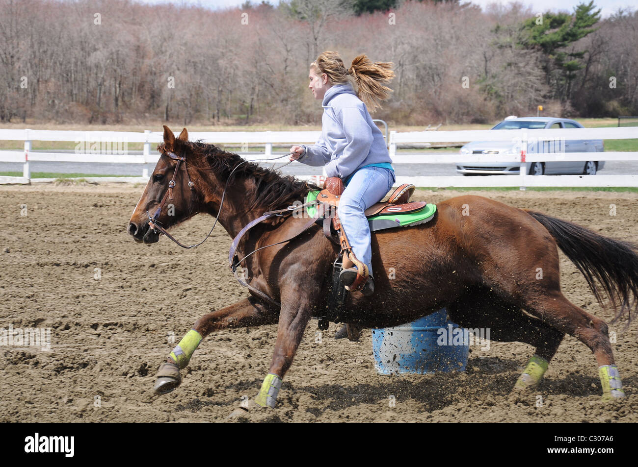 Young blond woman barrel racing Stock Photo - Alamy