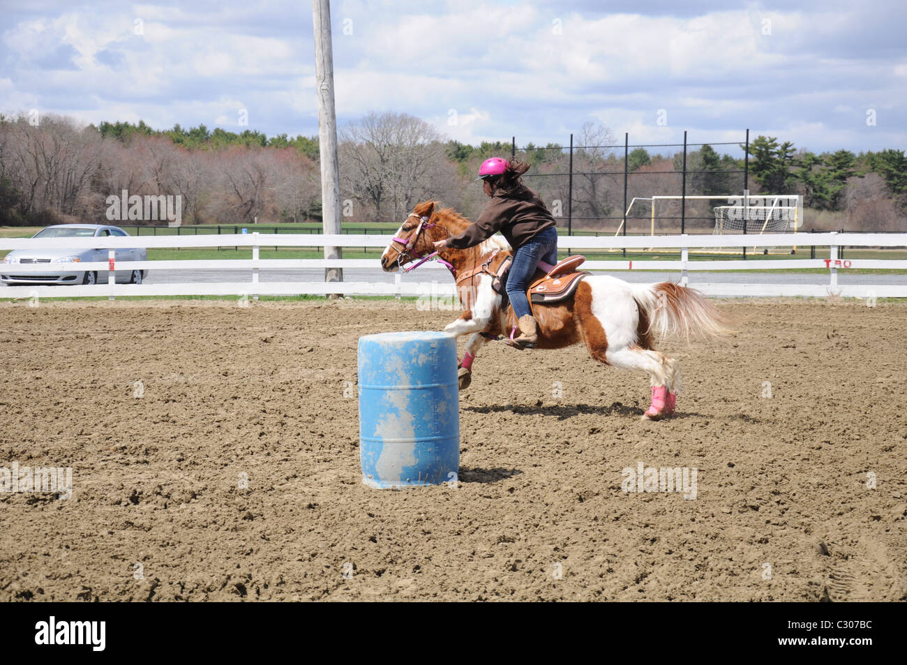 Teenage girl barrel racing Stock Photo - Alamy