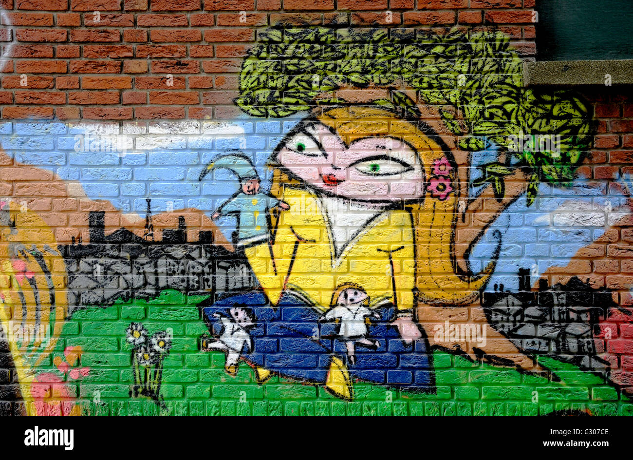 Delft, Netherlands. Graffiti - girl playing with glove puppet Stock ...