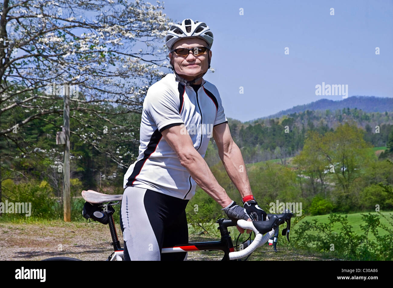 Older man riding exercise bike hi-res stock photography and images - Alamy