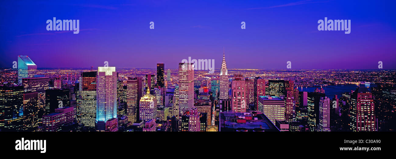 Panoramic photo looking East of midtown Manhattan skyline at dusk ...