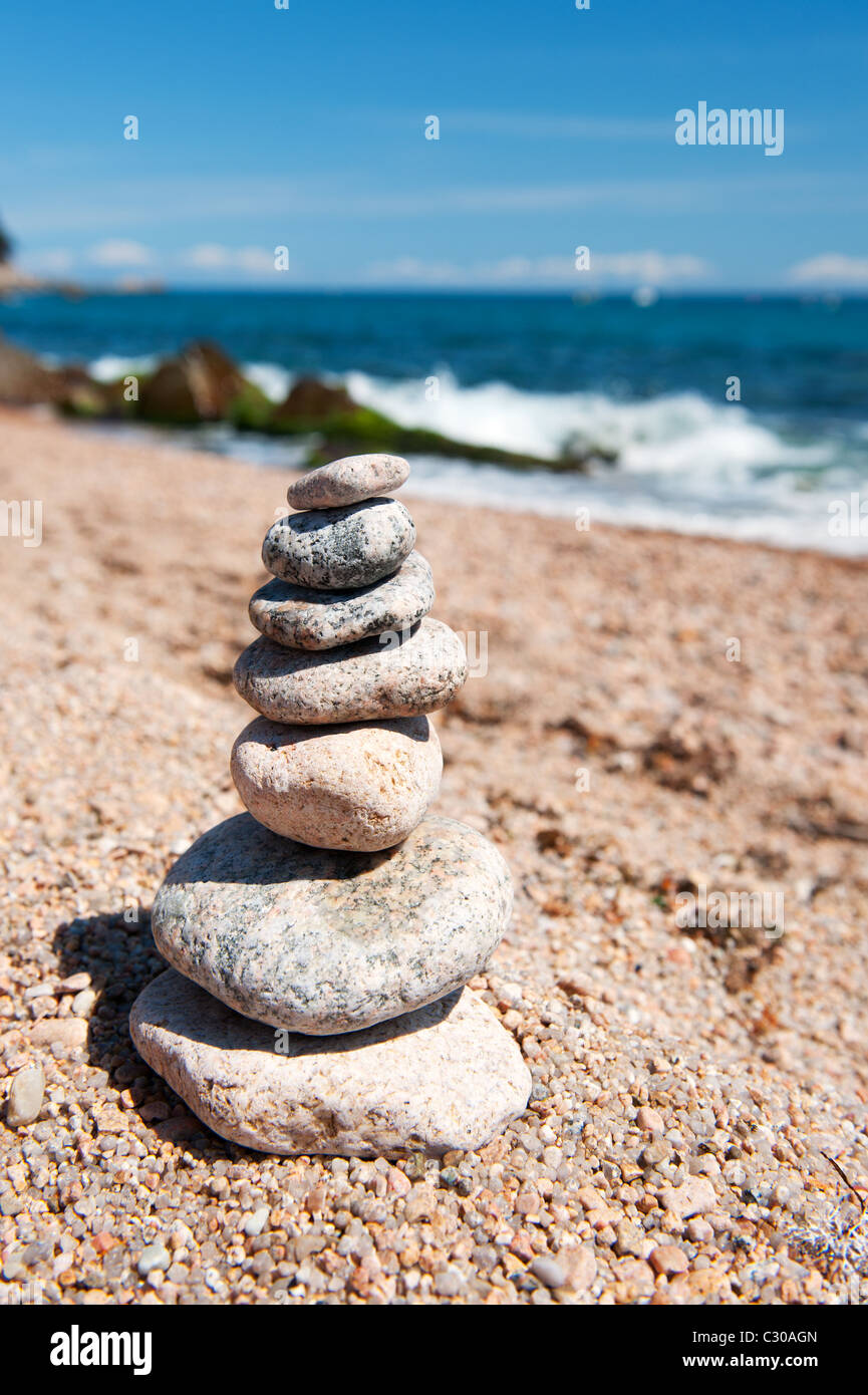 stacked pebbles at the beach Stock Photo - Alamy