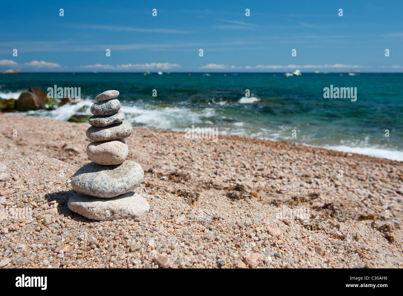stacked pebbles at the beach Stock Photo - Alamy
