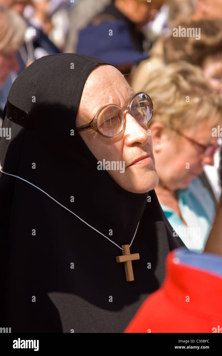 Praying nun at the Good Friday procession 2011 in Munich, Bavaria ...