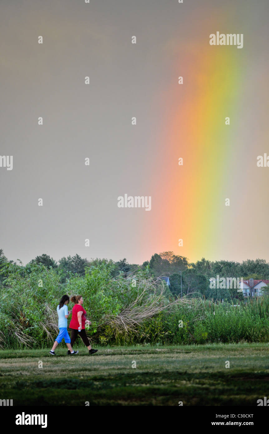 Two women walking on park hi-res stock photography and images - Alamy