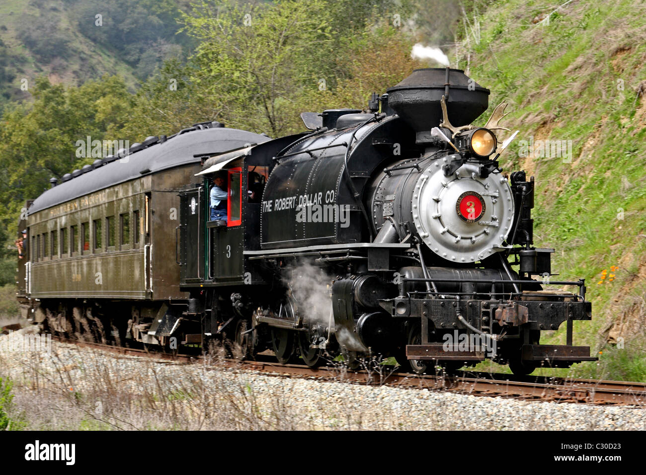 The Robert Dollar Co. steam engine #3 pulls a passenger train through ...
