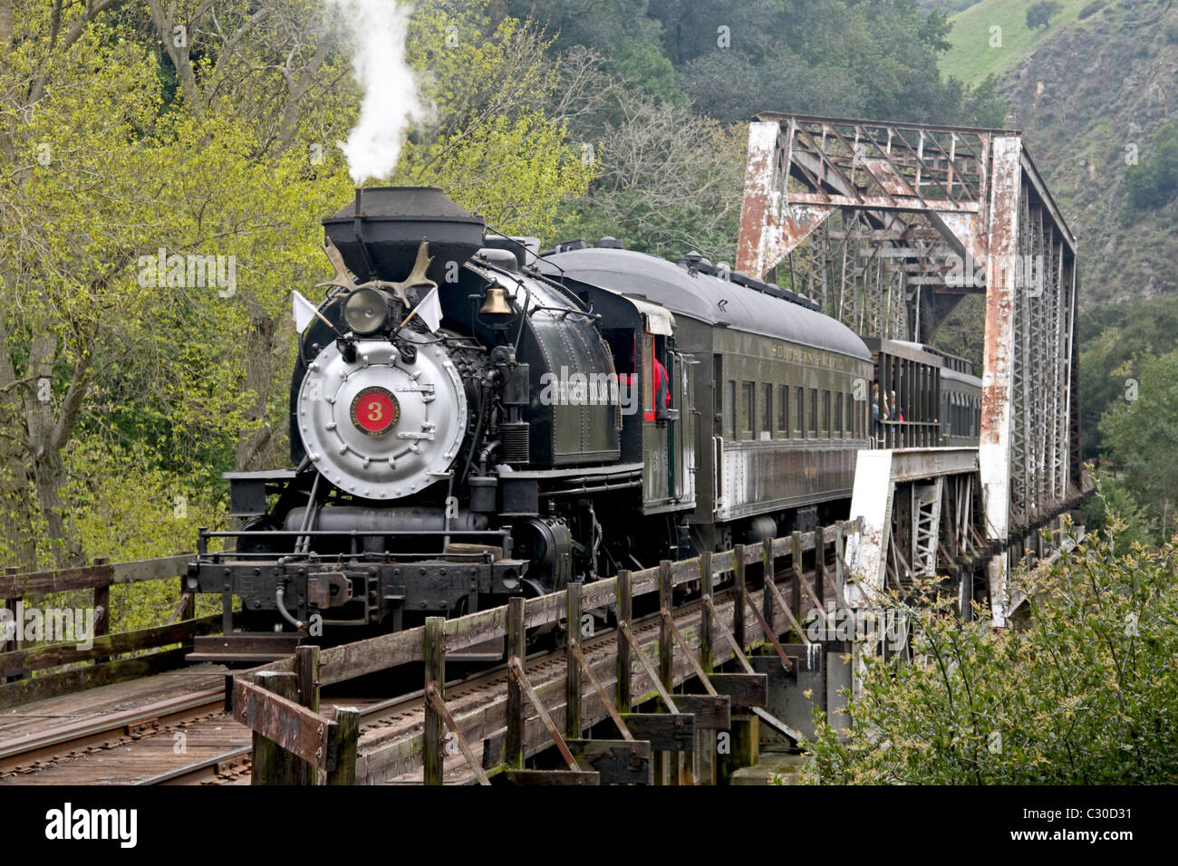 The Robert Dollar Co. steam engine #3 pulls a passenger train over a ...